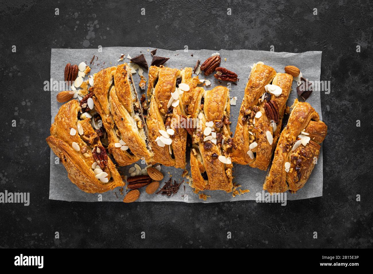 Homemade chocolate puff pastry braided strudel, pie with pecan nuts and ...