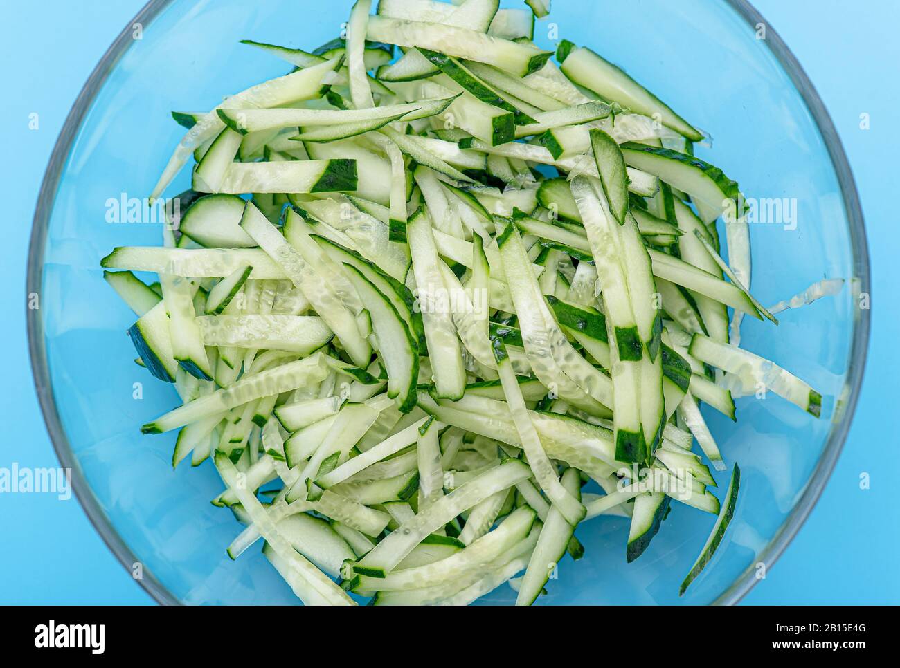 Chopped Cucumber Slices in glass Bowl for green Salad Stock Photo - Alamy