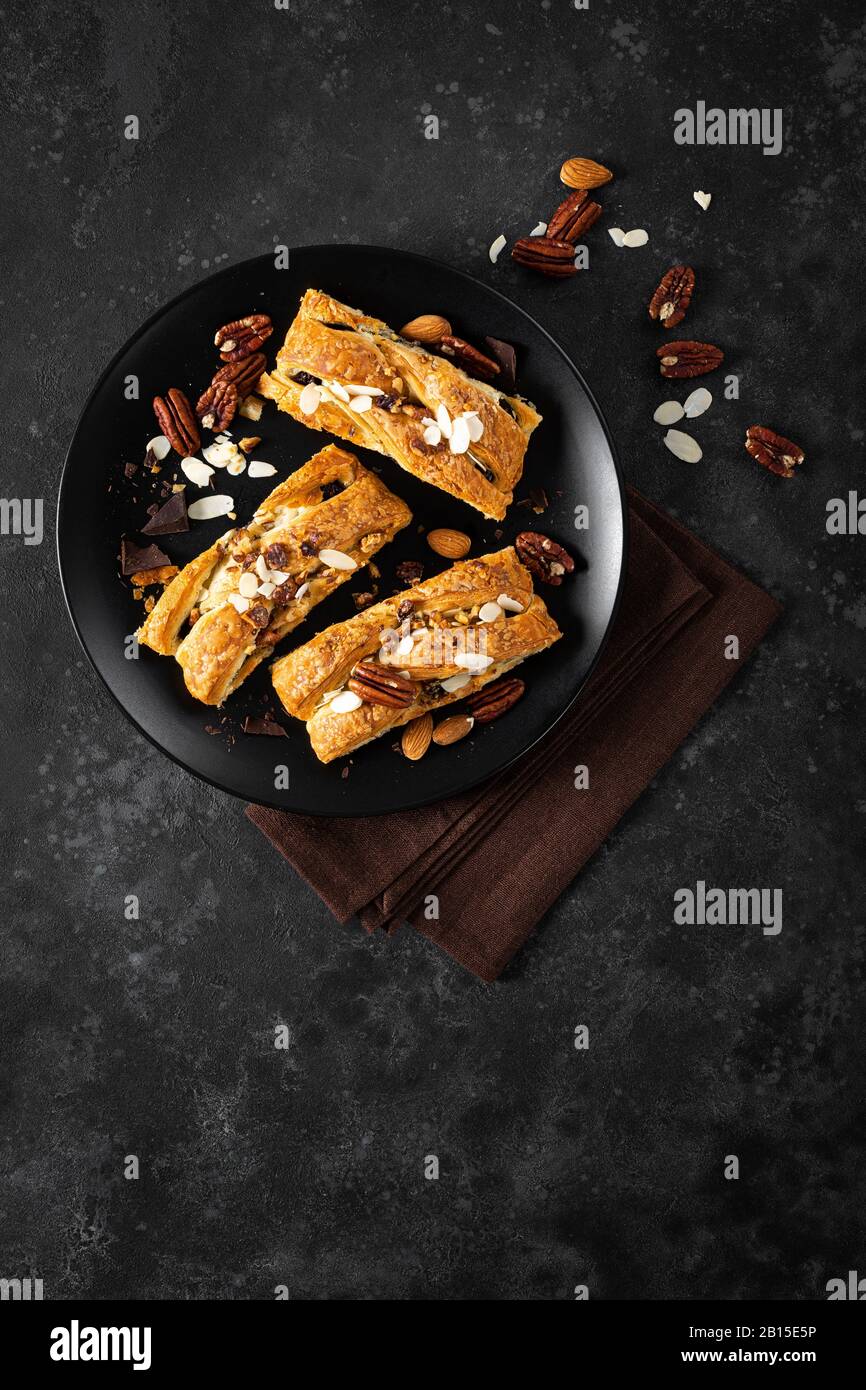 Homemade chocolate puff pastry braided strudel, pie with pecan nuts and ...