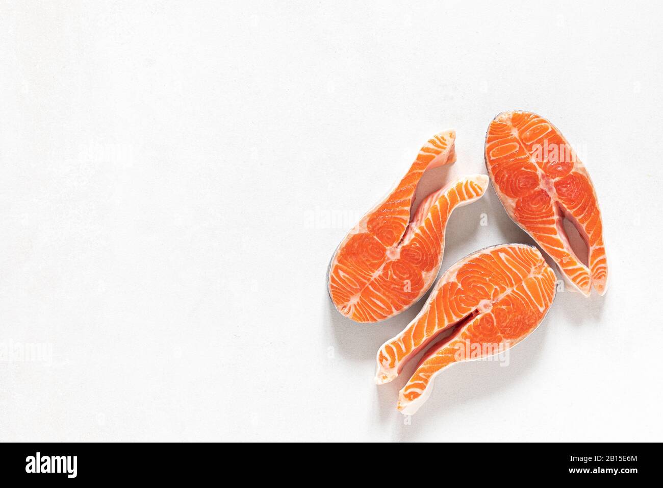 Salmon. Fresh raw salmon fish steaks on white background, top view ...