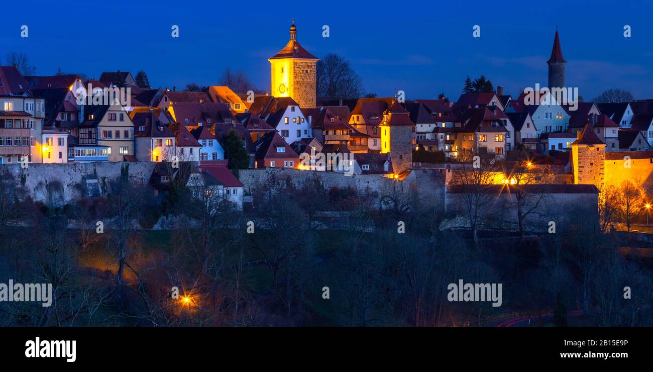 Night aerial panoramic view of roofs, towers and town wall in medieval ...