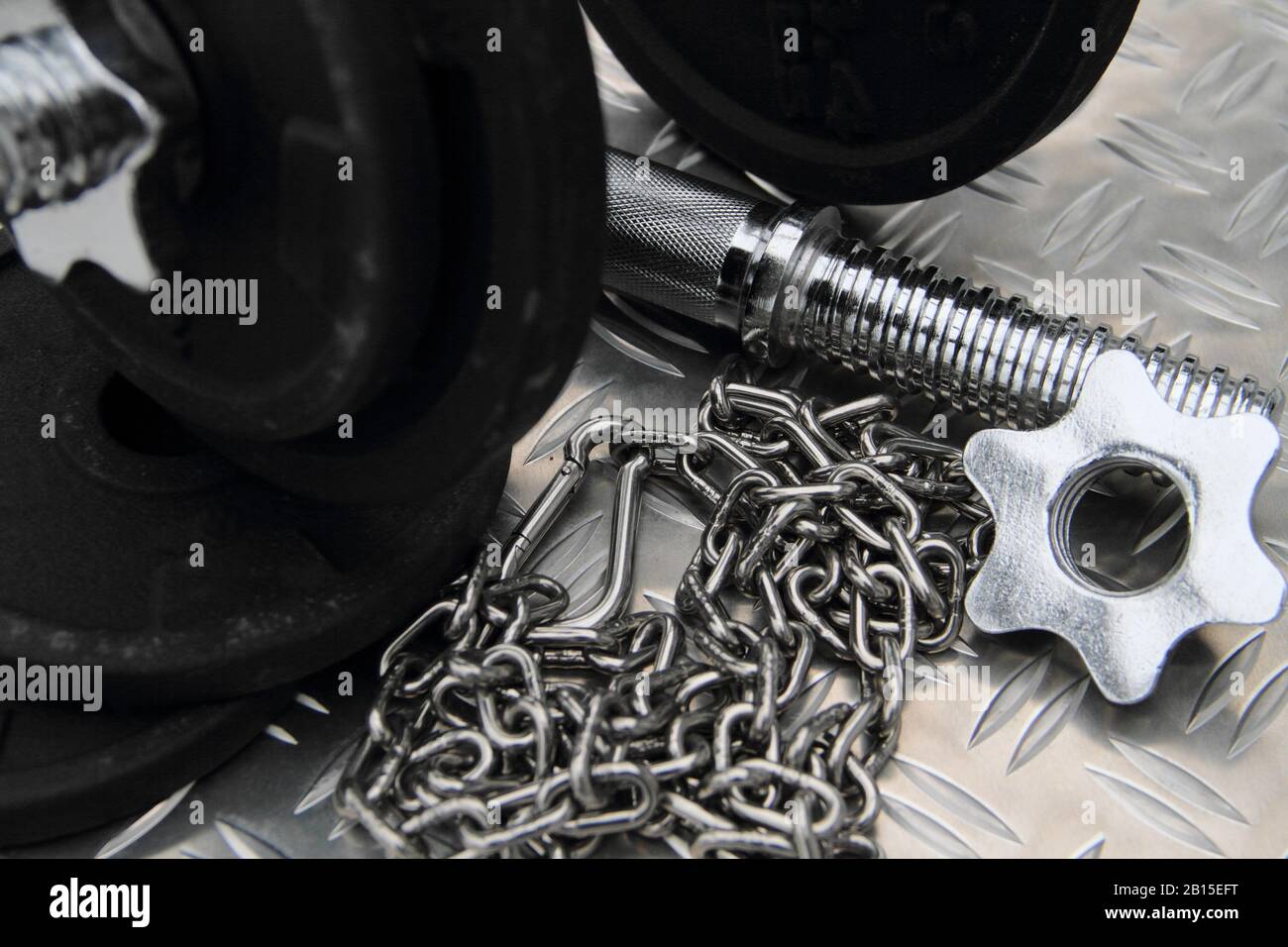 Weights and a chain in a gym Stock Photo - Alamy
