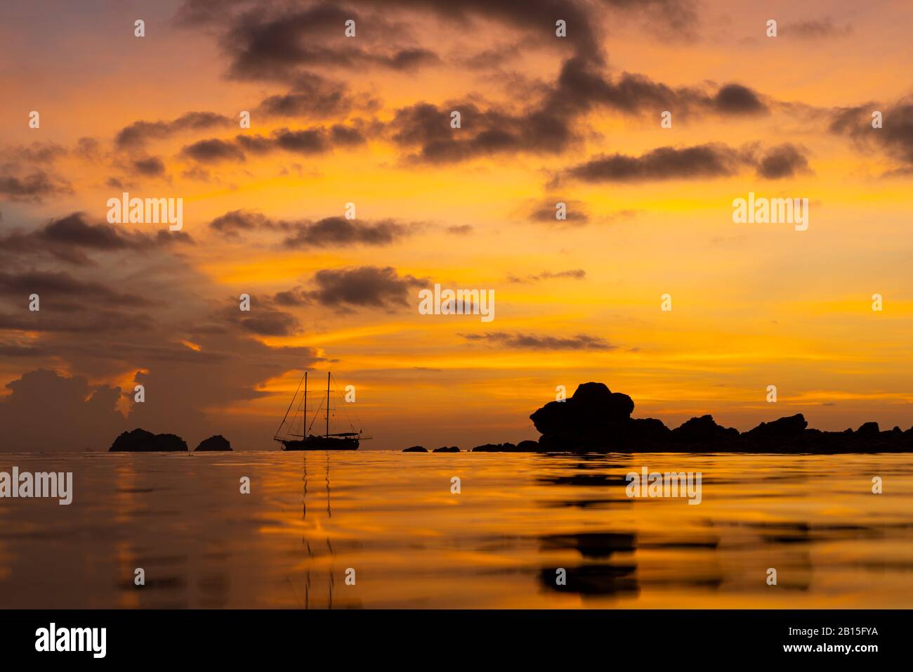 Colorful sunset on a tropical beach. Orange sunset on the ocean ...