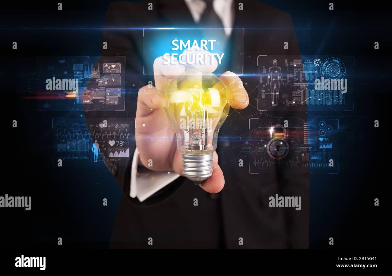 Businessman holding lightbulb with SMART SECURITY inscription, online ...