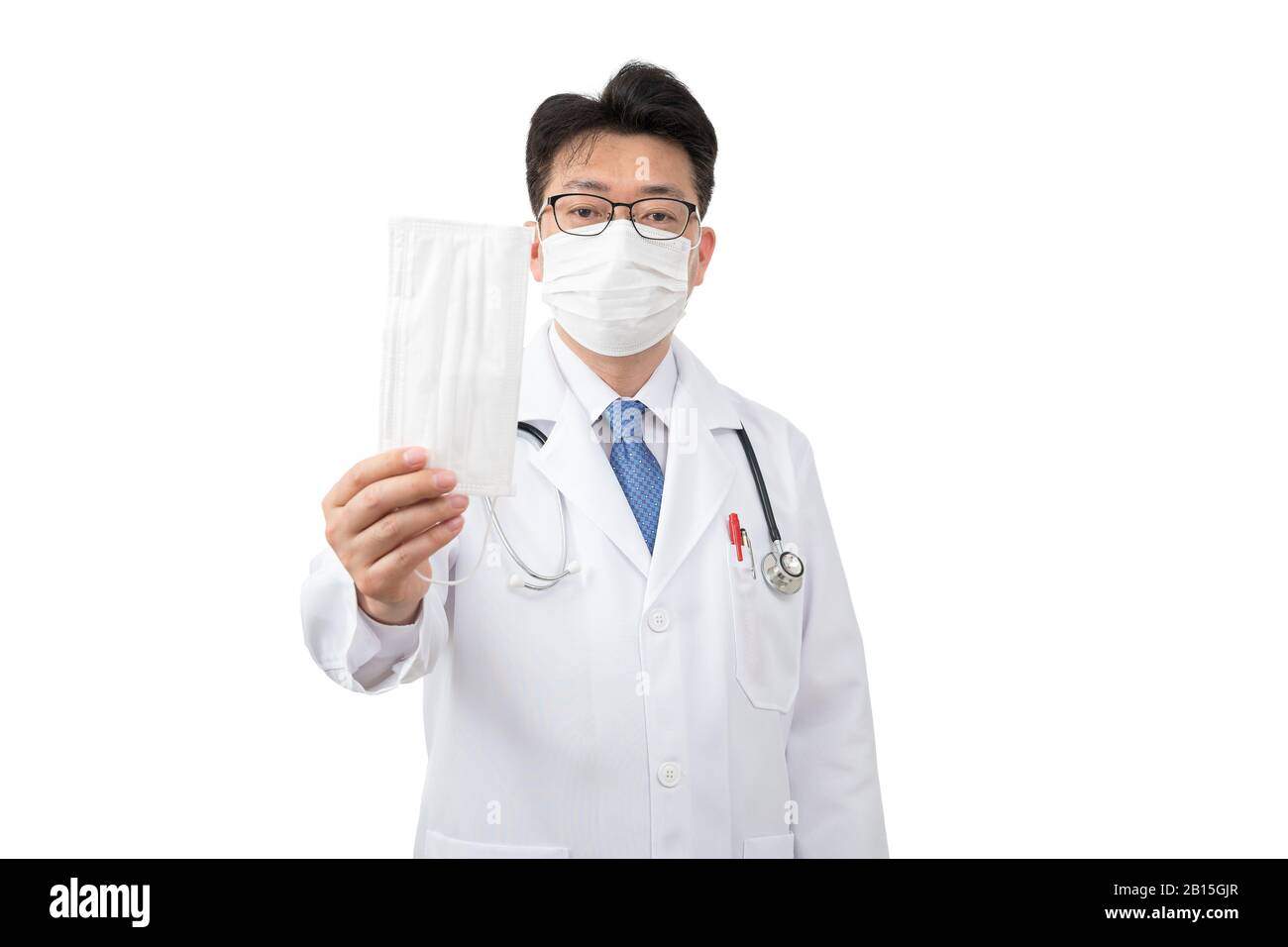 Middle-aged Asian doctor holding the disposable mask in his hand Stock ...