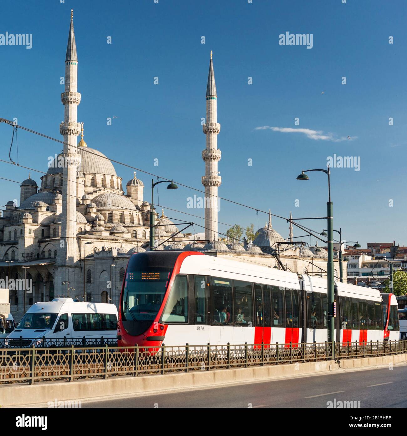 ISTANBUL - MAY 24, 2013: A modern tram rides over the Galata Bridge on ...