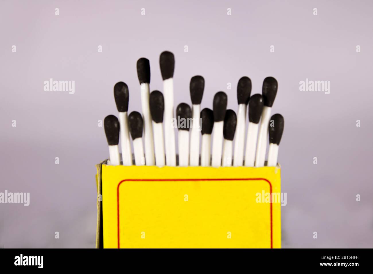 A creative concept of a wax match box with with stick and black head ...