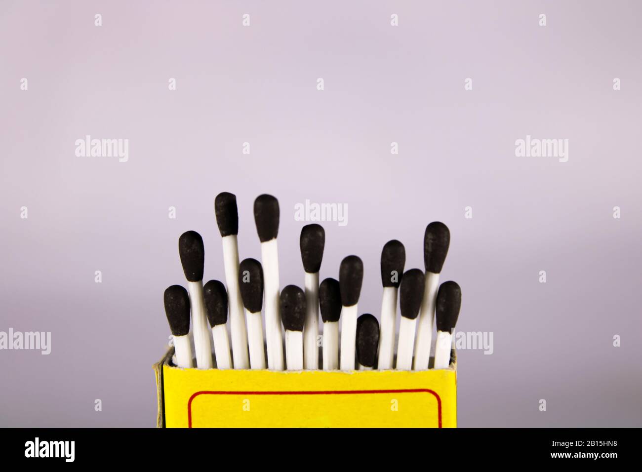 A creative concept of a wax match box with with stick and black head ...