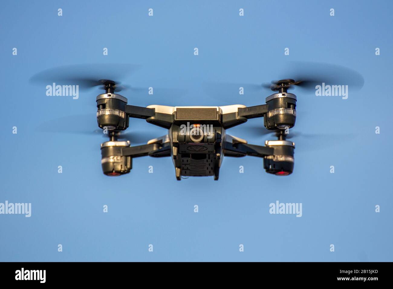 Drone flying in a blue sky. Photo 1 Stock Photo - Alamy