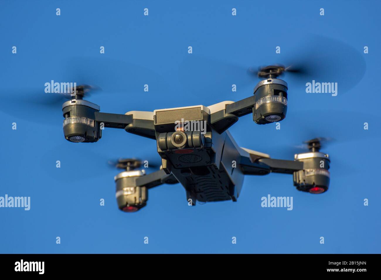 Drone flying in a blue sky. Photo 2 Stock Photo - Alamy