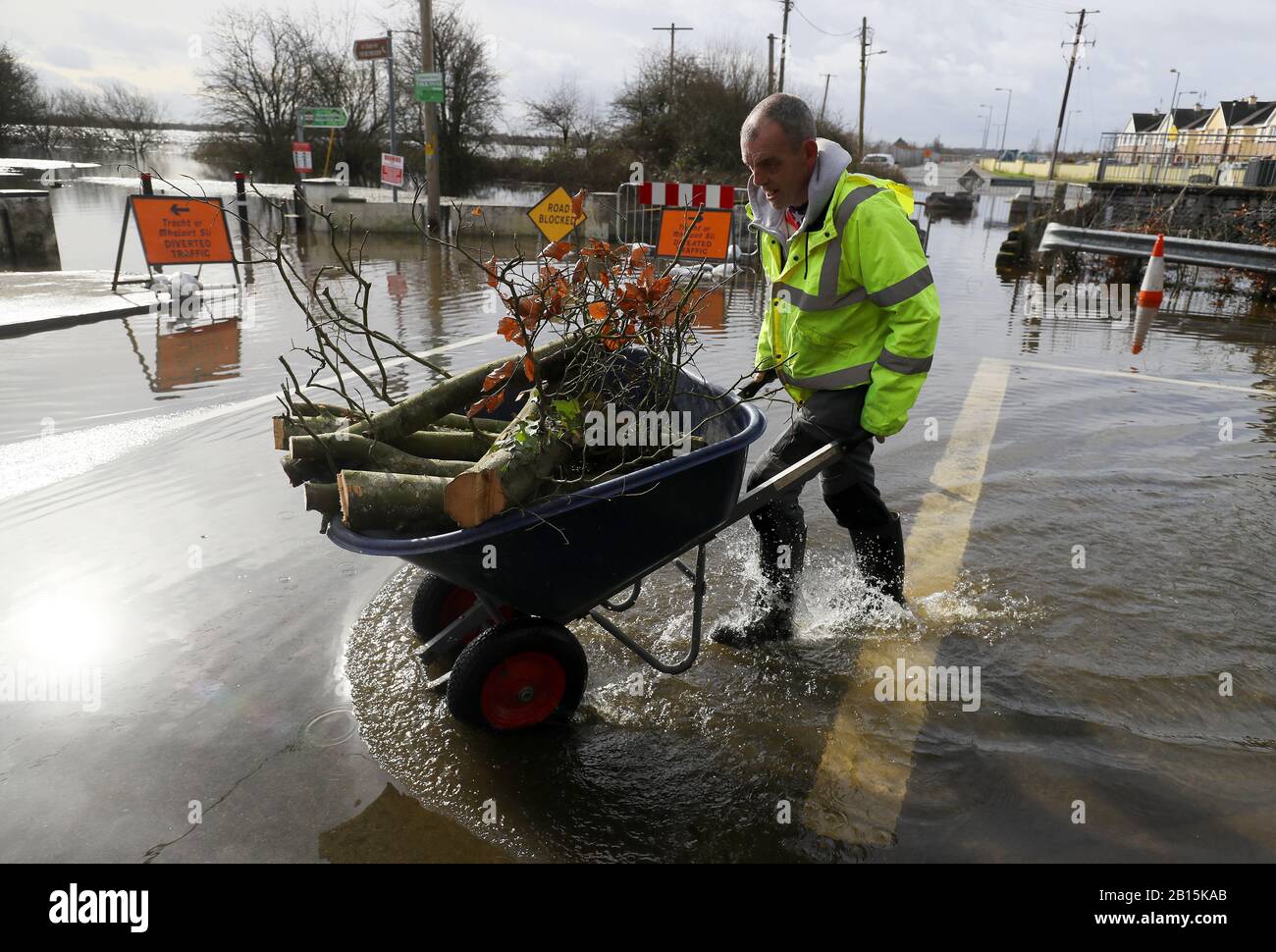 Athlone resident brendan pushes wheel through flood water in athlone hi ...