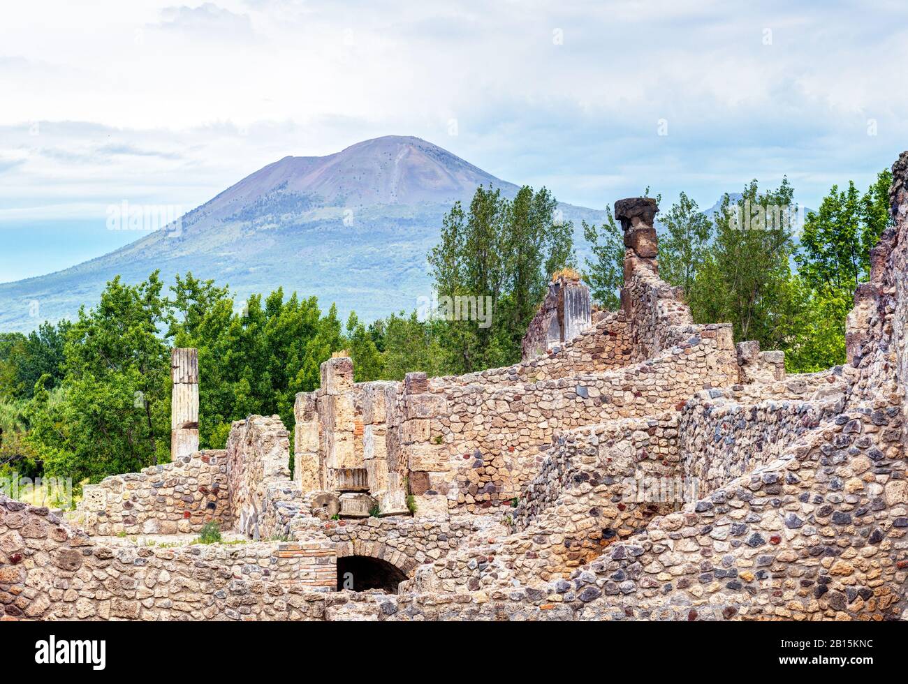Ruins of Pompeii with Vesuvius in the distance, Italy. Pompeii is an ...