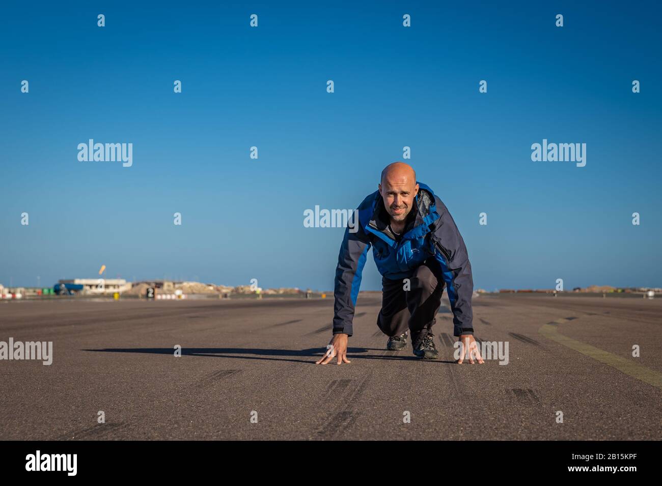 man running on the runway at the airport Stock Photo - Alamy