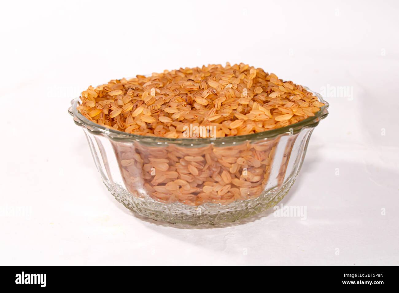 Close up Rice devzira Red with white background Stock Photo - Alamy