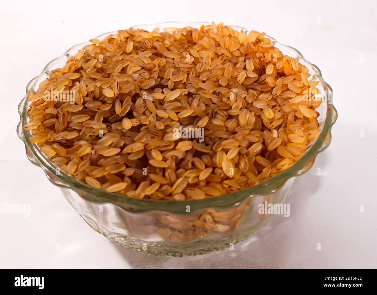 Close up Rice devzira Red with white background Stock Photo - Alamy