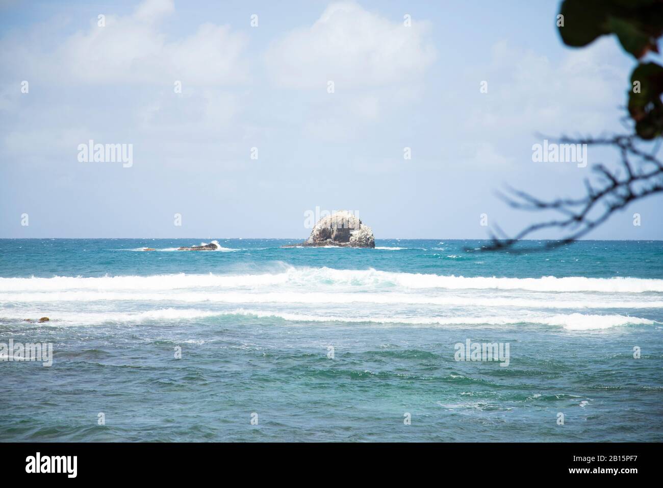 Beautiful coastal photography - a rock standing up to the battering of ...