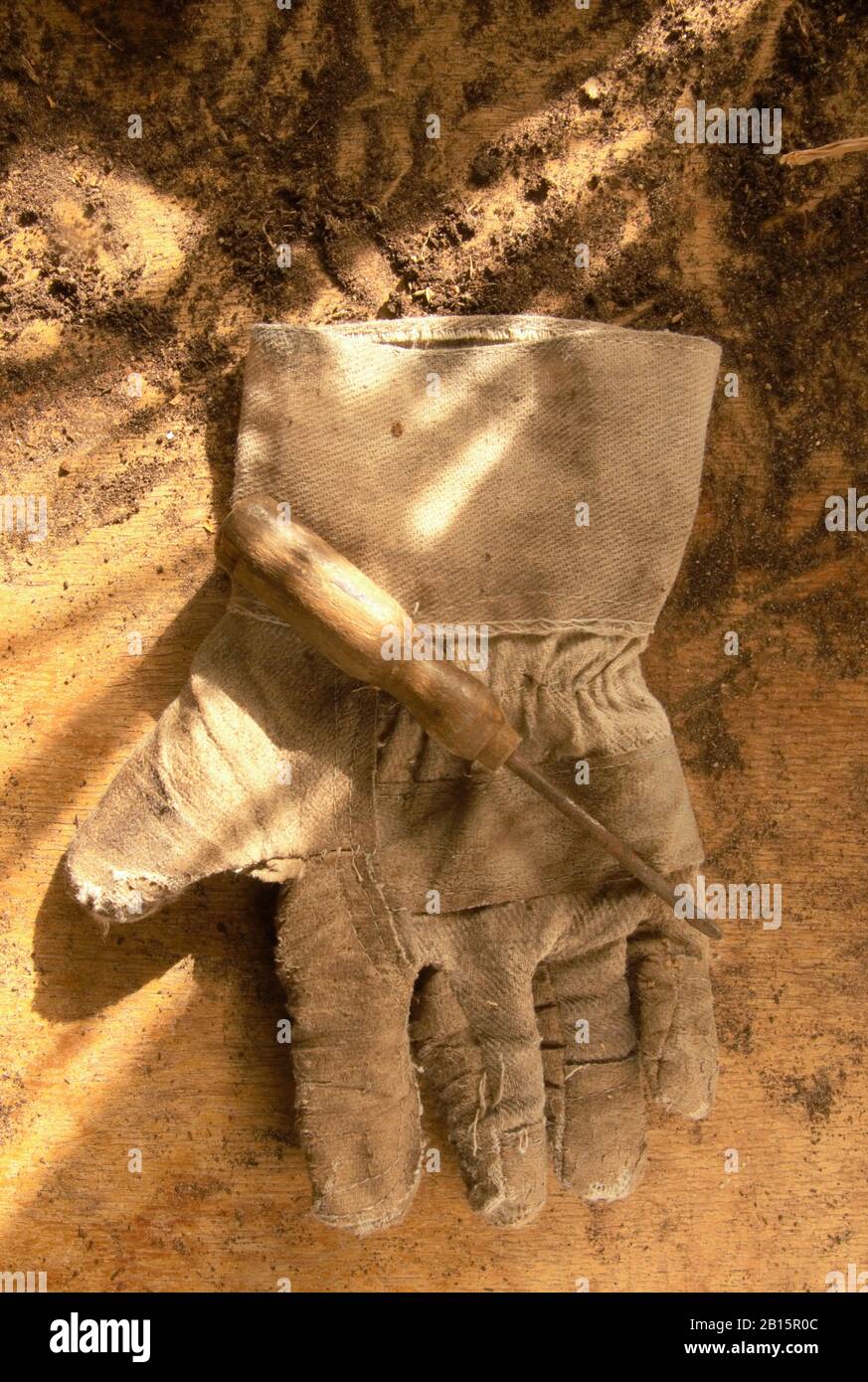 Dirty gloves hi-res stock photography and images - Alamy