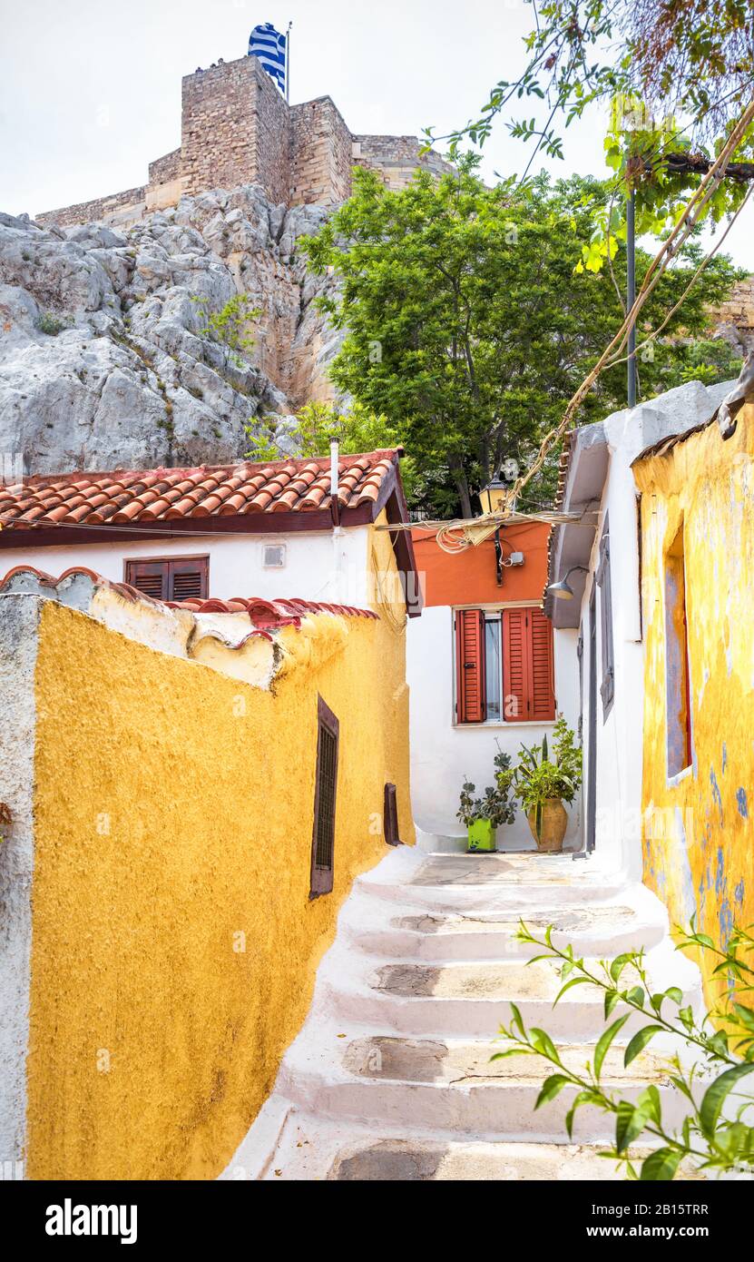 Scenic narrow street with old houses in Anafiotika, Plaka district ...