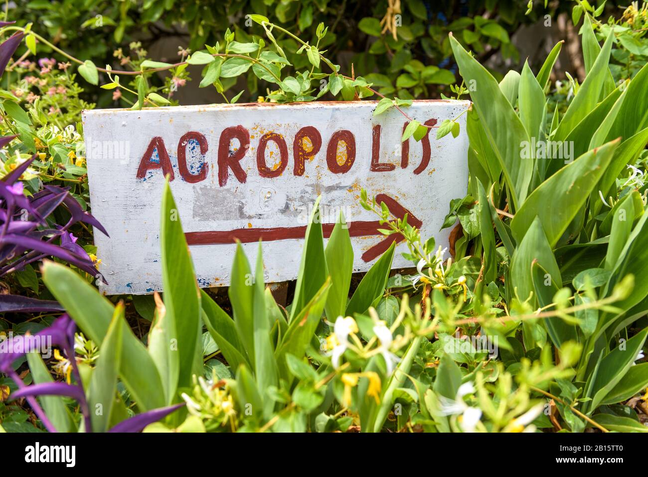 Handmade signpost pointing to the Acropolis in Anafiotika area of Plaka ...