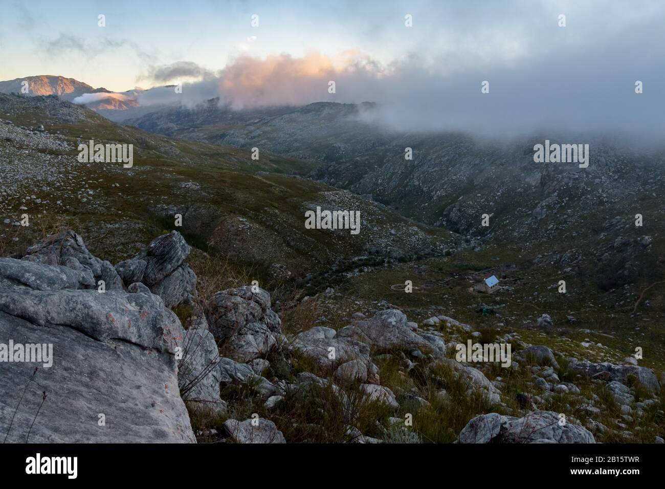 Rising fog over mountain cabin Stock Photo - Alamy