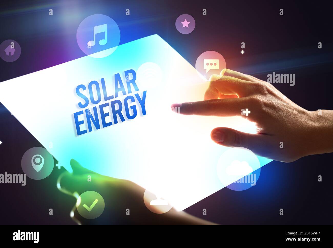 Holding futuristic tablet with SOLAR ENERGY inscription, new technology ...