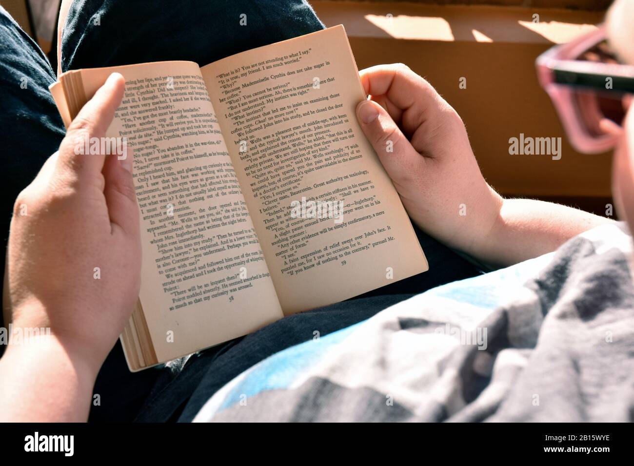 Reading a book Stock Photo - Alamy