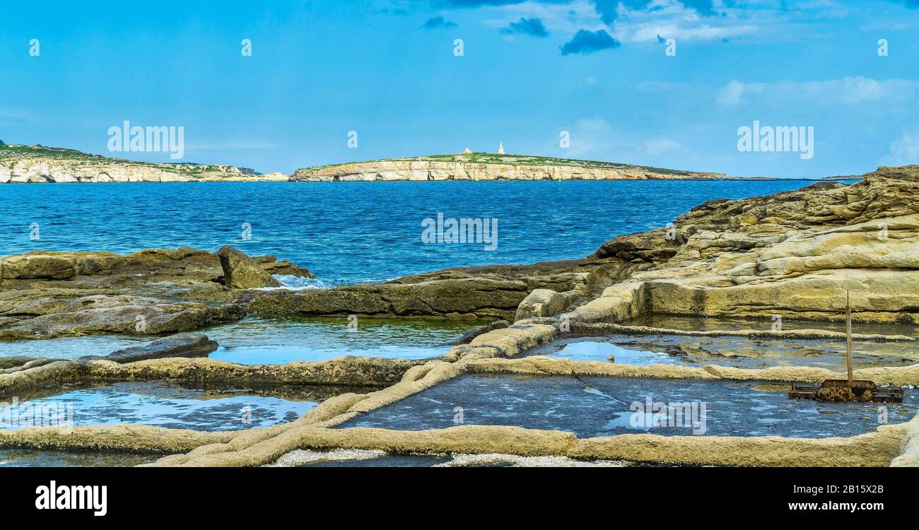 Malta, Bugibba: Traditional salt-pans, known as salini, cut into the ...