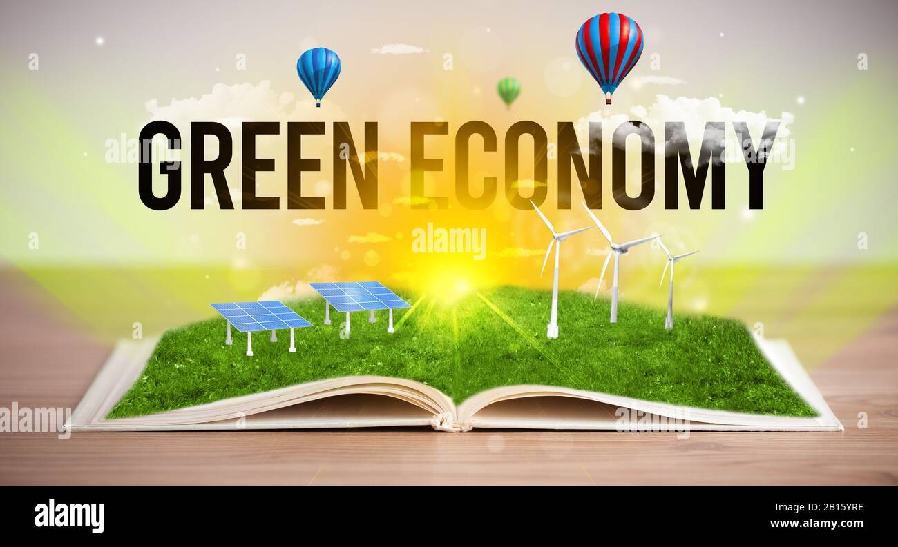 Open book with GREEN ECONOMY inscription, renewable energy concept ...