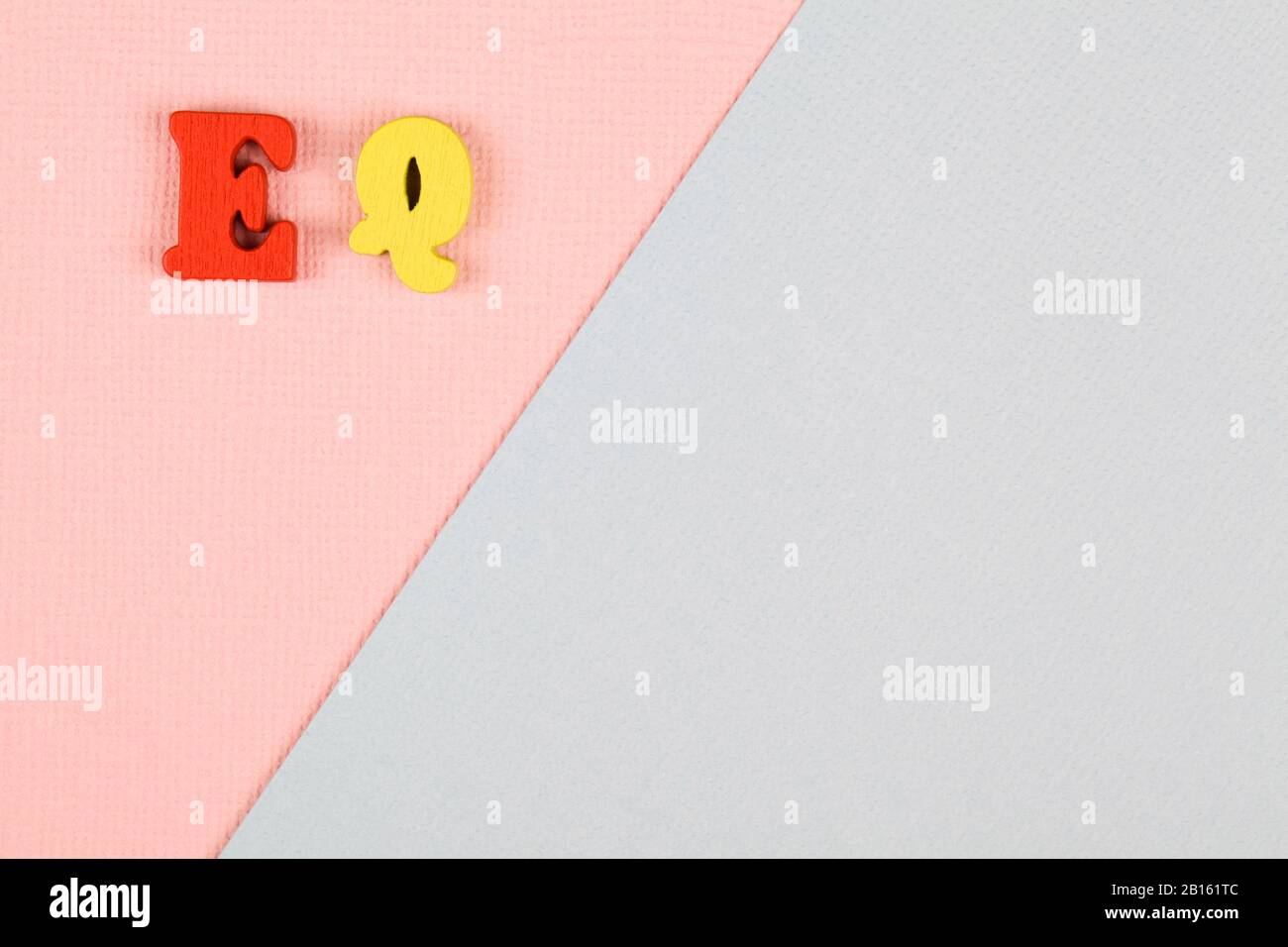 Colorful Wooden Word ' EQ ' or Emotional Quotient. copy space close up ...
