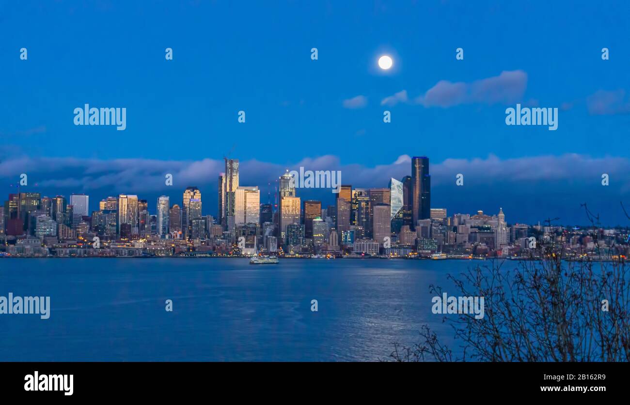 A bright full moon shines over the Seattle skyline Stock Photo - Alamy