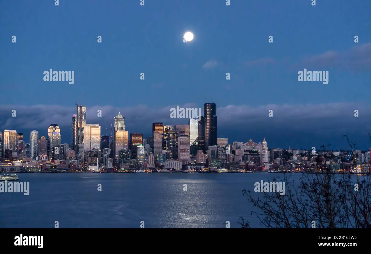 A bright full moon shines over the Seattle skyline Stock Photo - Alamy