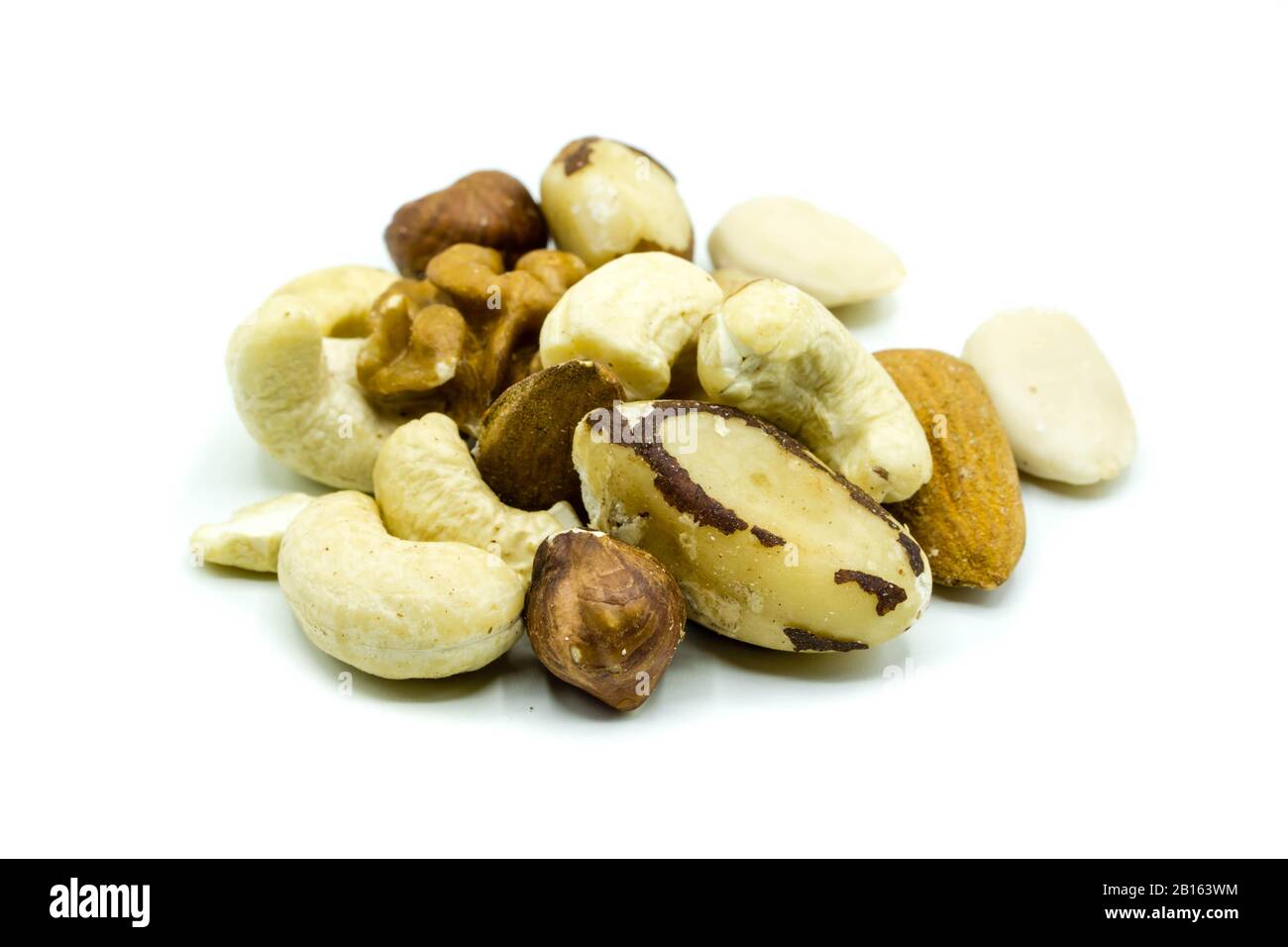 Nut mix isolated on white background Stock Photo - Alamy