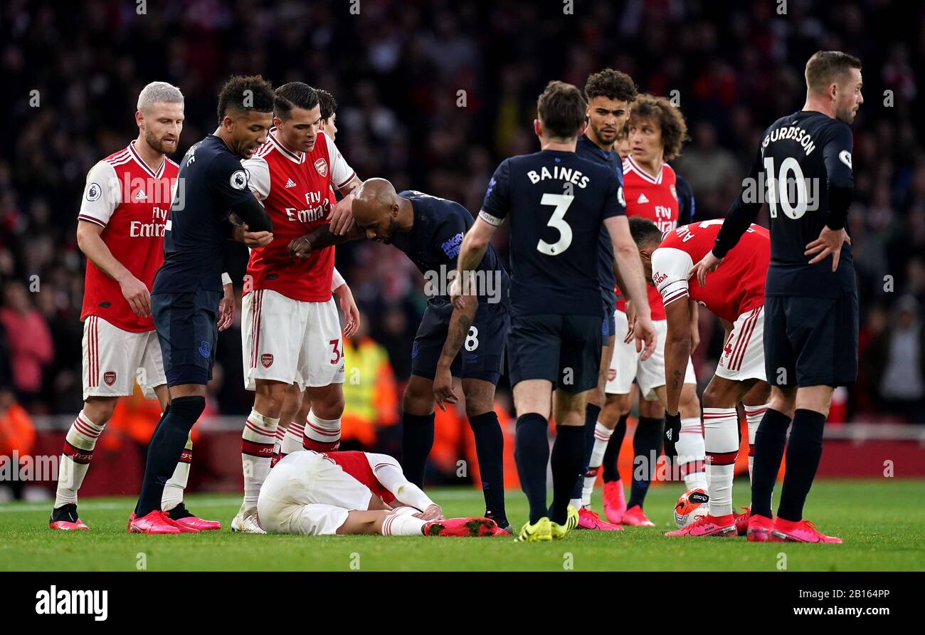 Arsenal's Dani Ceballos lies on the pitch following a foul by Everton's ...