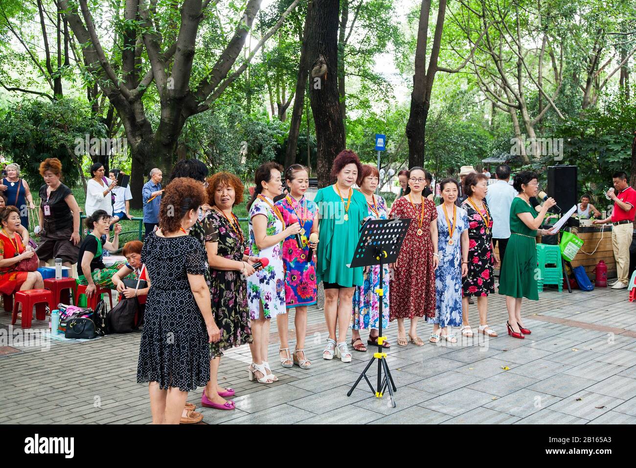 Group of Chinese ladies singing in Chengdu People's Park China Stock ...