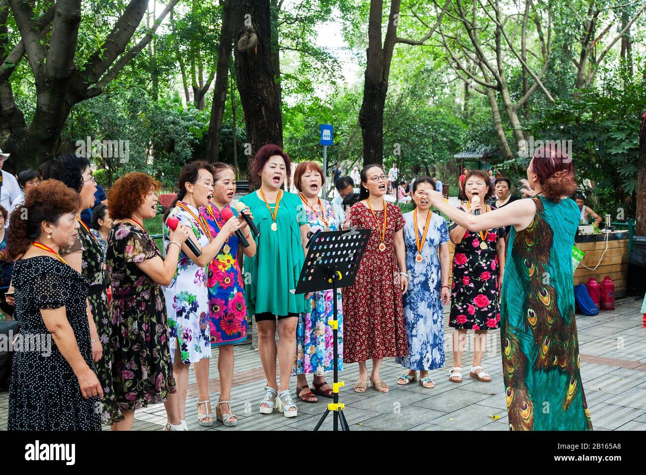 Group of Chinese ladies singing in Chengdu People's Park China Stock ...