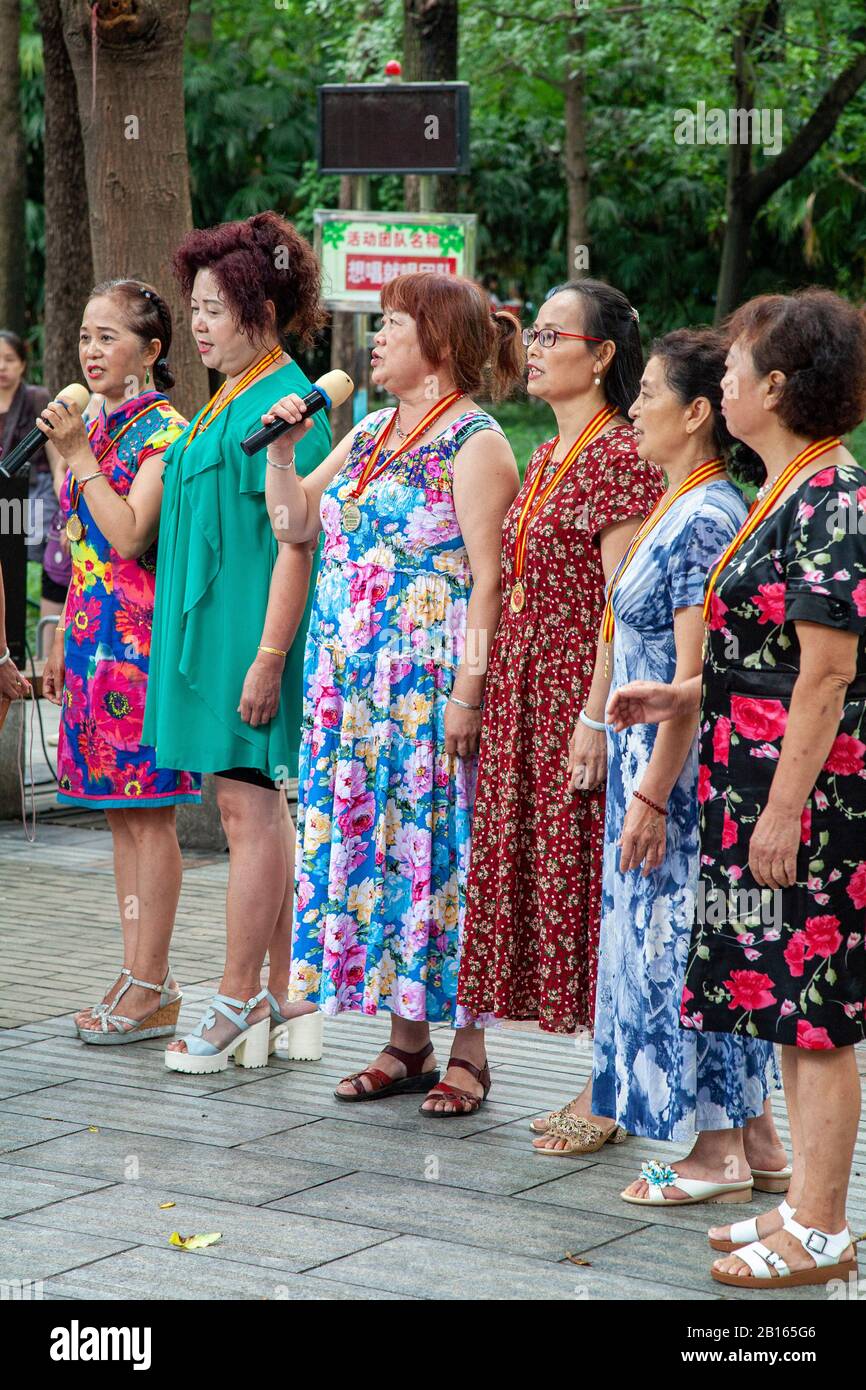 Group of Chinese ladies singing in Chengdu People's Park China Stock ...