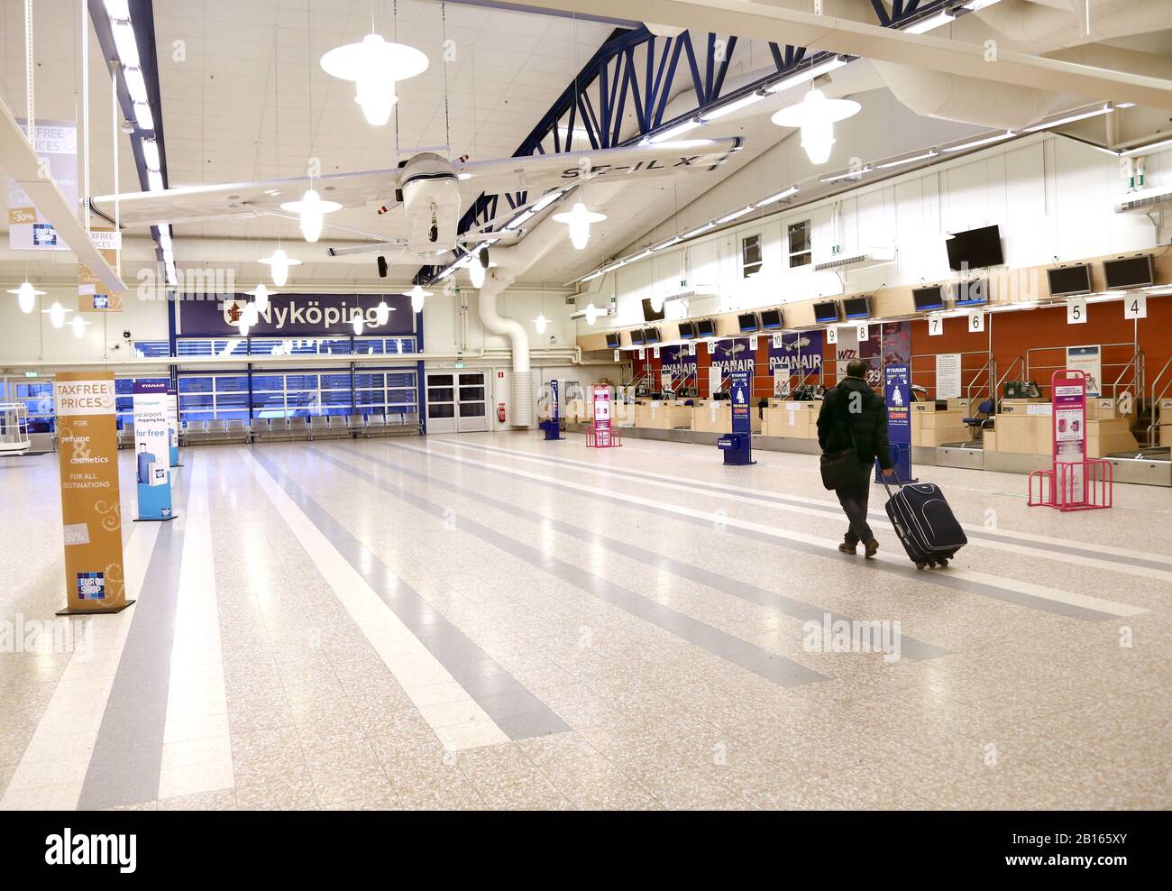 Stockholm Skavsta Airport. Solo traveler in check-in hall.Photo Jeppe ...