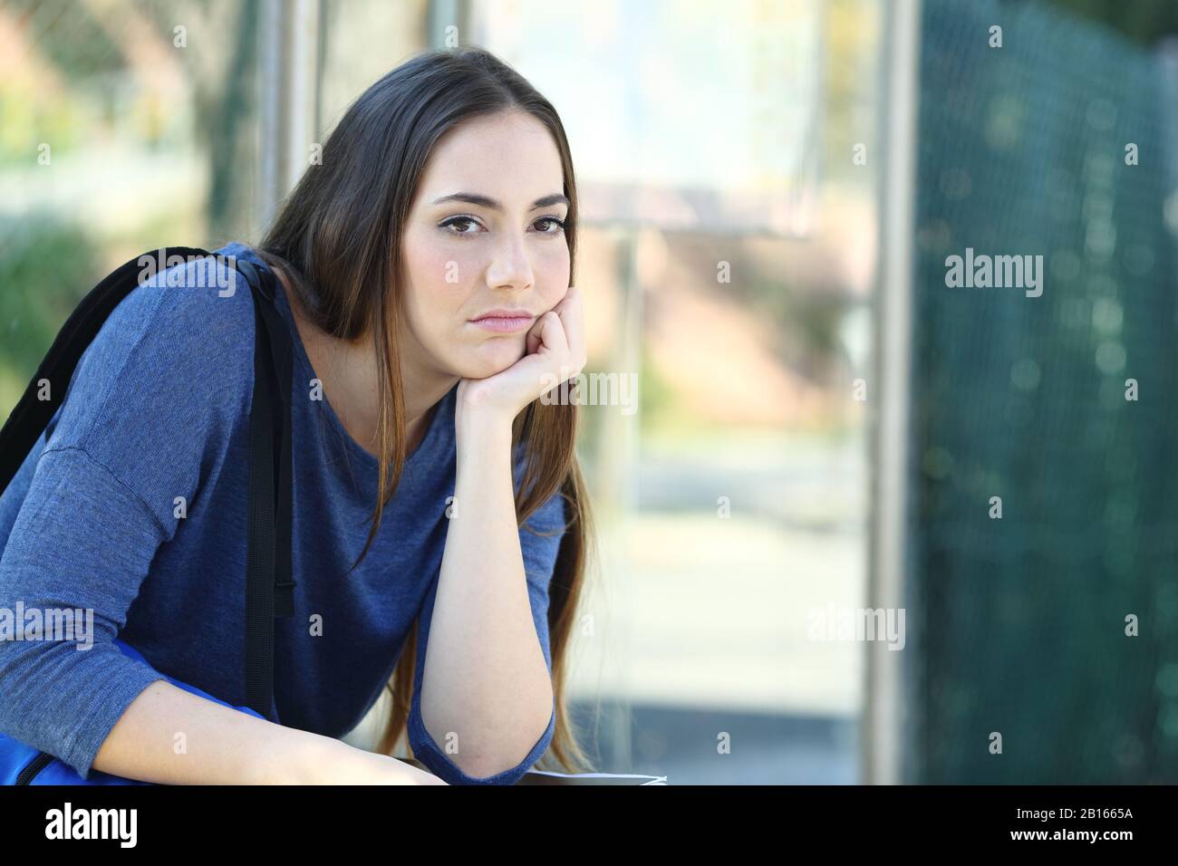Bored at a bus station hi-res stock photography and images - Alamy