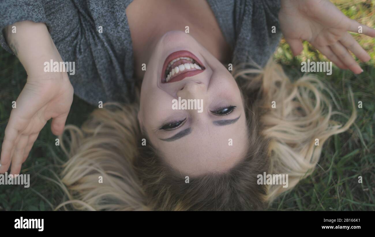 Happy Young Woman Close Eyes Game Lie Green Lawn. Joyful Caucasian ...