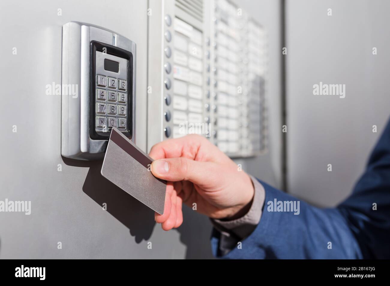 Man scanning security key card on electric lock to entry private ...
