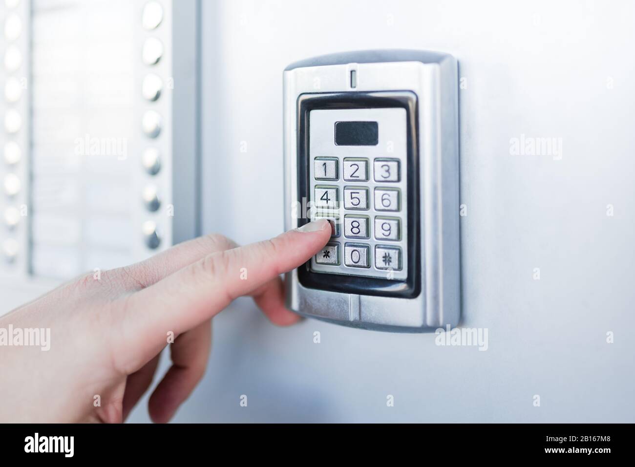 Close up of businessman hand entering security system code Stock Photo ...