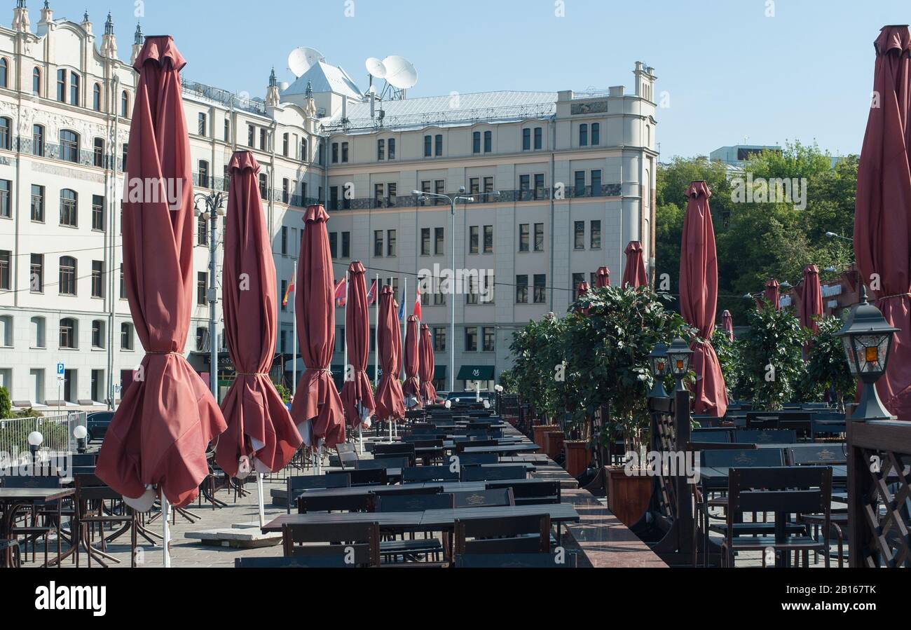 Tables in a street cafe before the opening in Moscow Stock Photo - Alamy