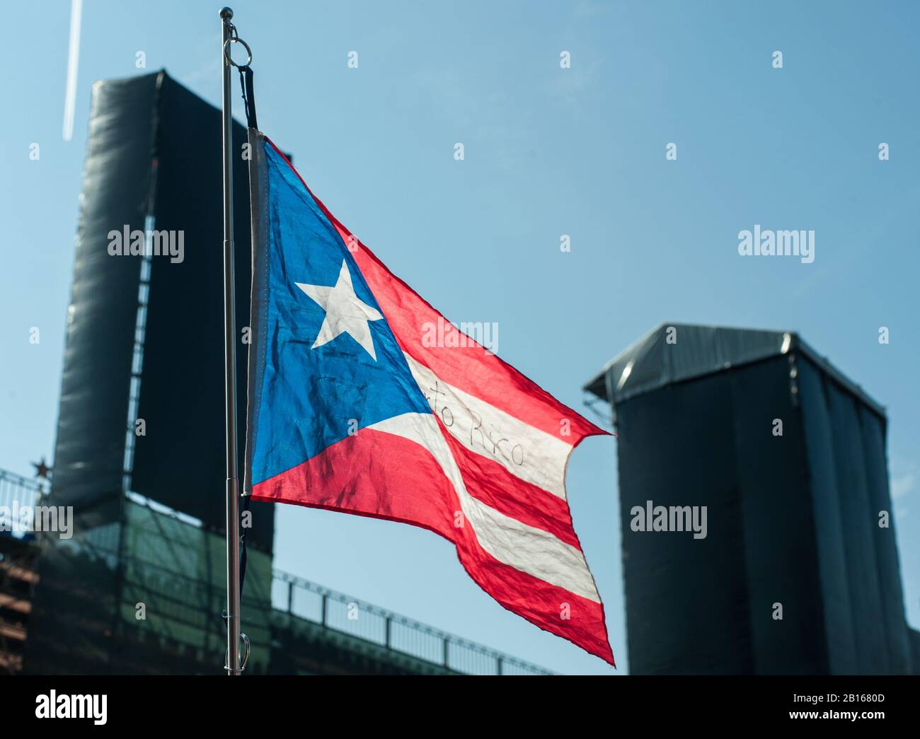 Flag of Puerto Rico against the blue sky Stock Photo - Alamy