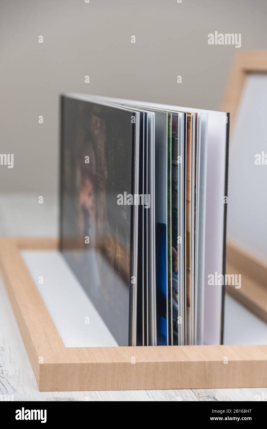 Side view close up of thick and rigid wedding album pages in a book ...
