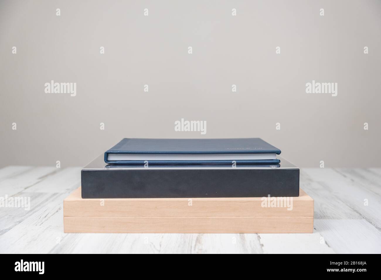 Stack of 3 albums books on isolated white blurred background with blank ...