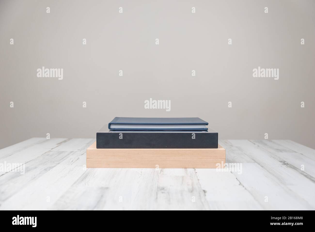 Stack of 3 albums books on isolated white blurred background with blank ...