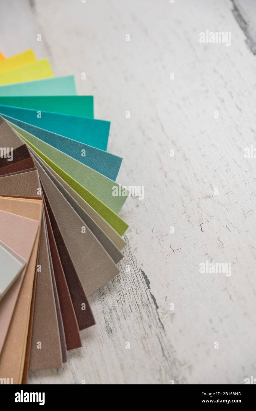 Colorful stack of sample test swatches for paint or fabric in spectrum ...