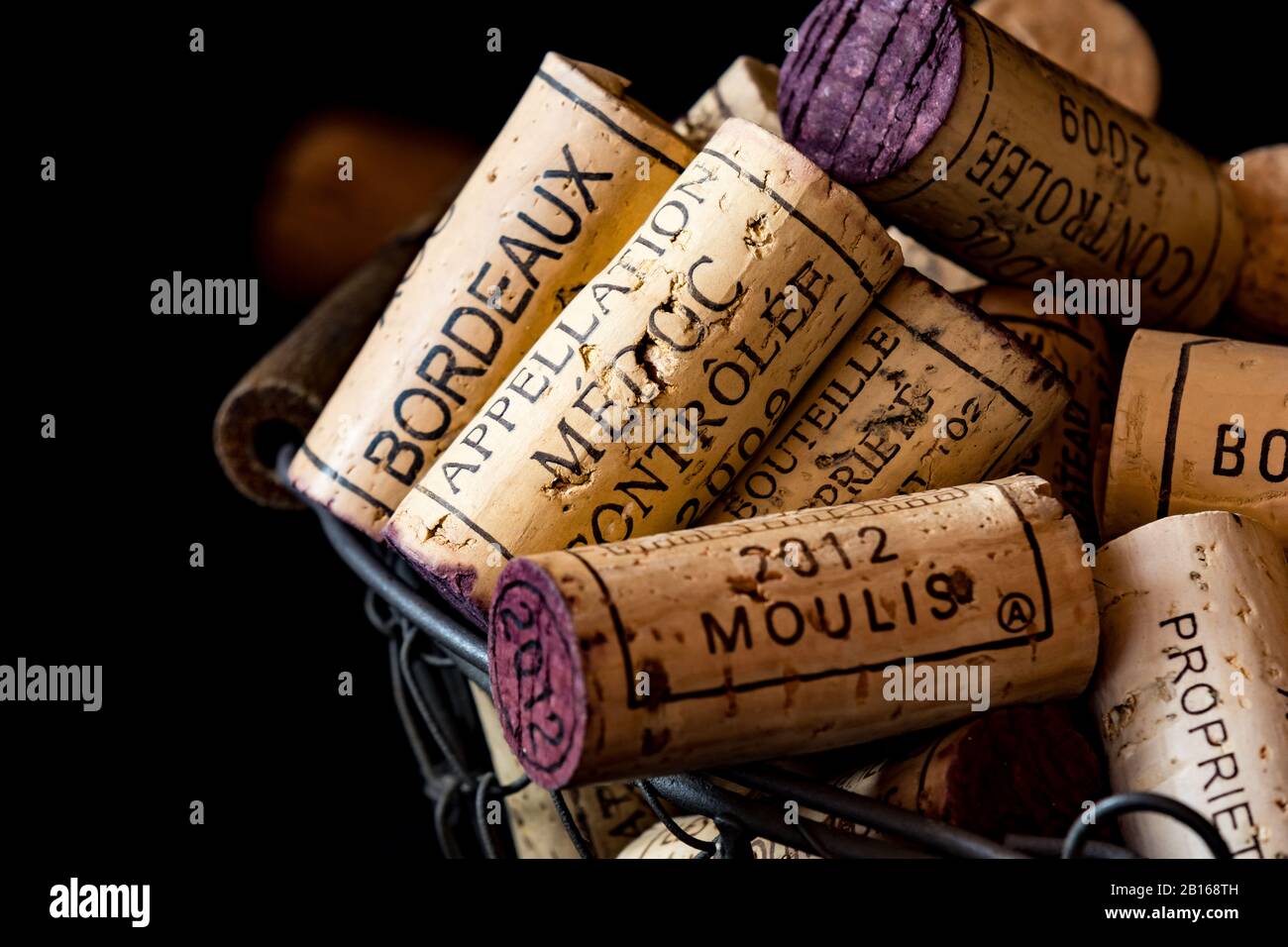 old cork stoppers of French wines in a wire basket Stock Photo - Alamy