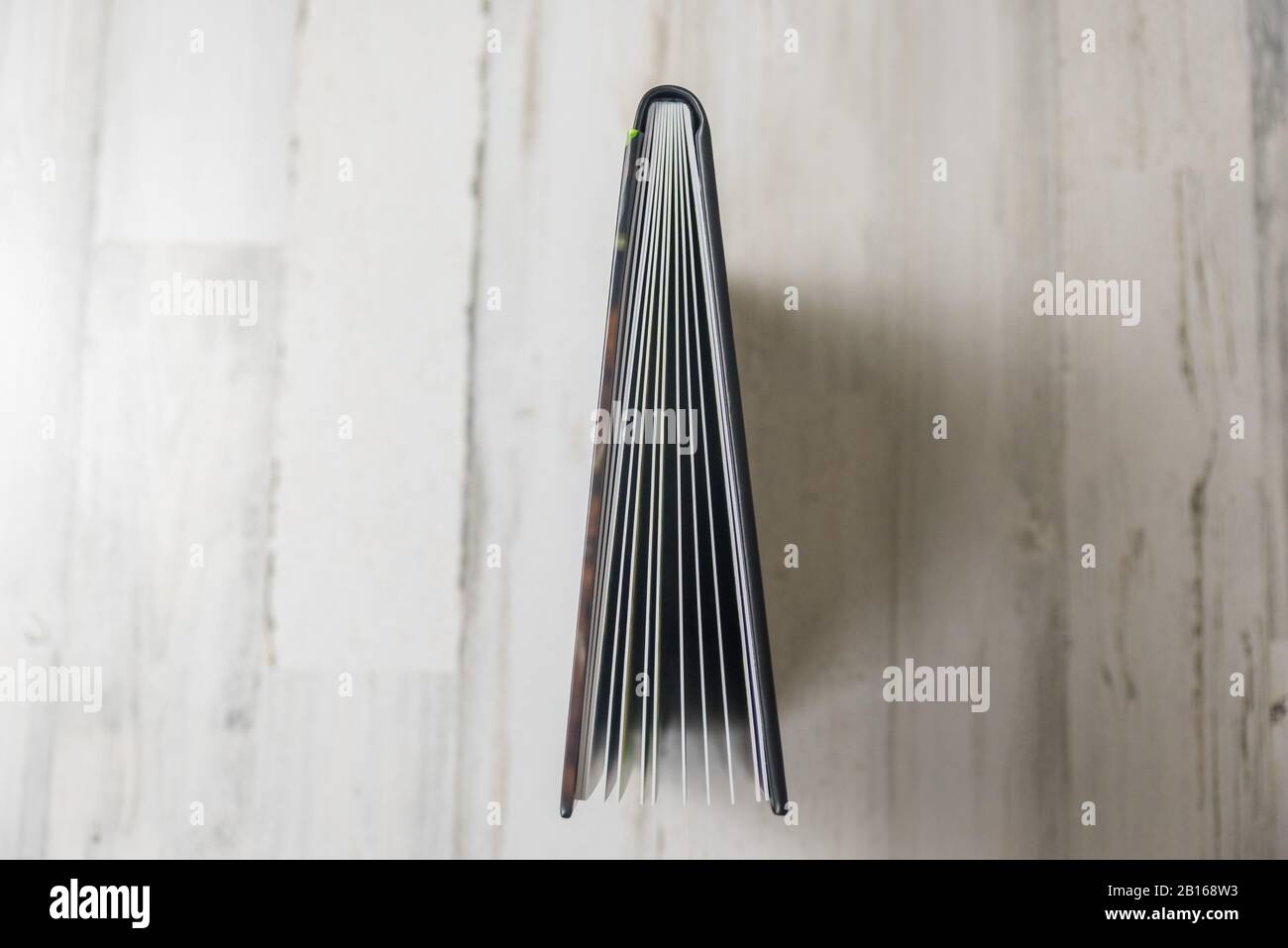 Top view close up of thick and rigid wedding album pages in a navy blue ...