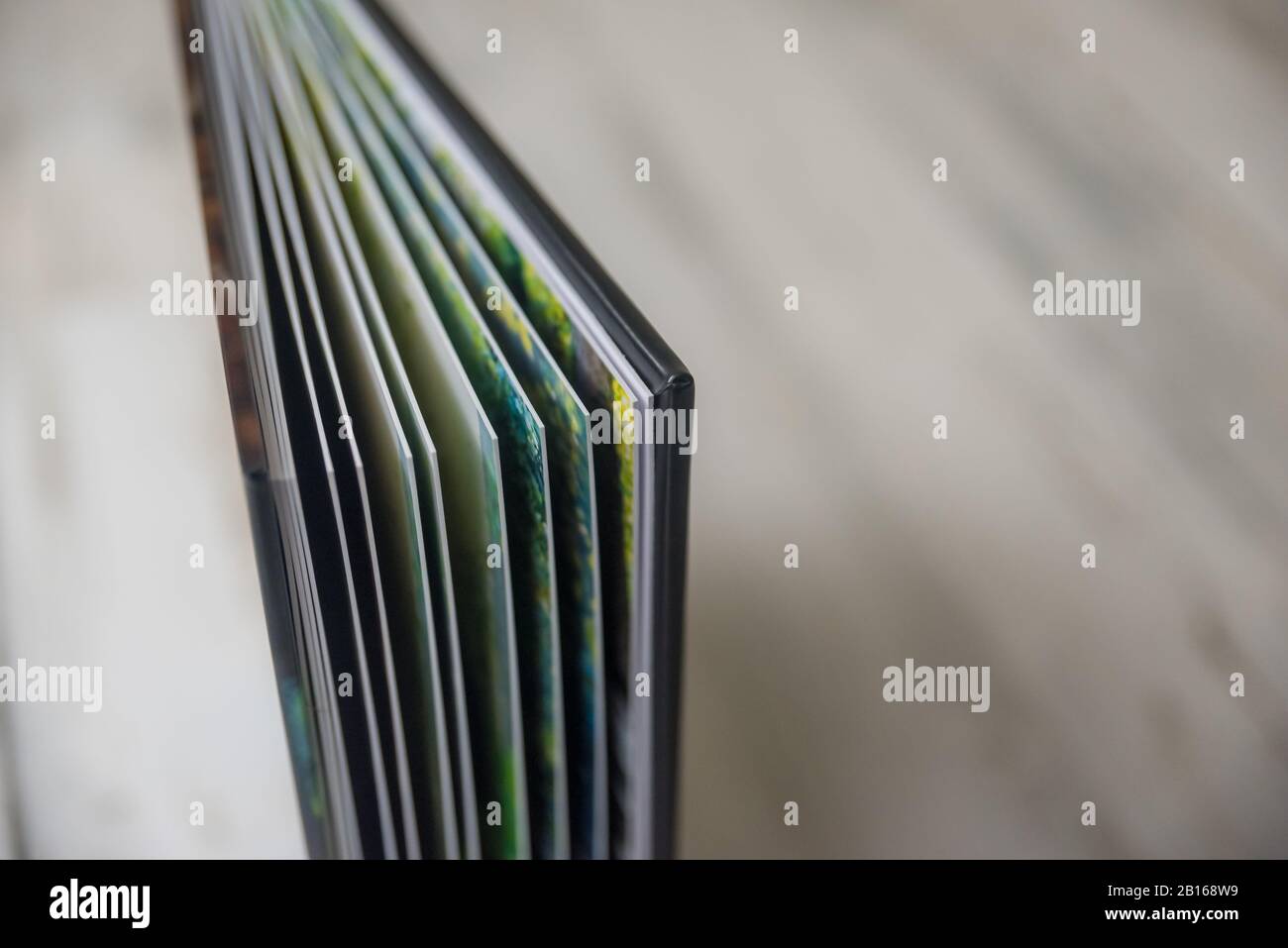 Side view close up of thick and rigid wedding album pages in a book ...